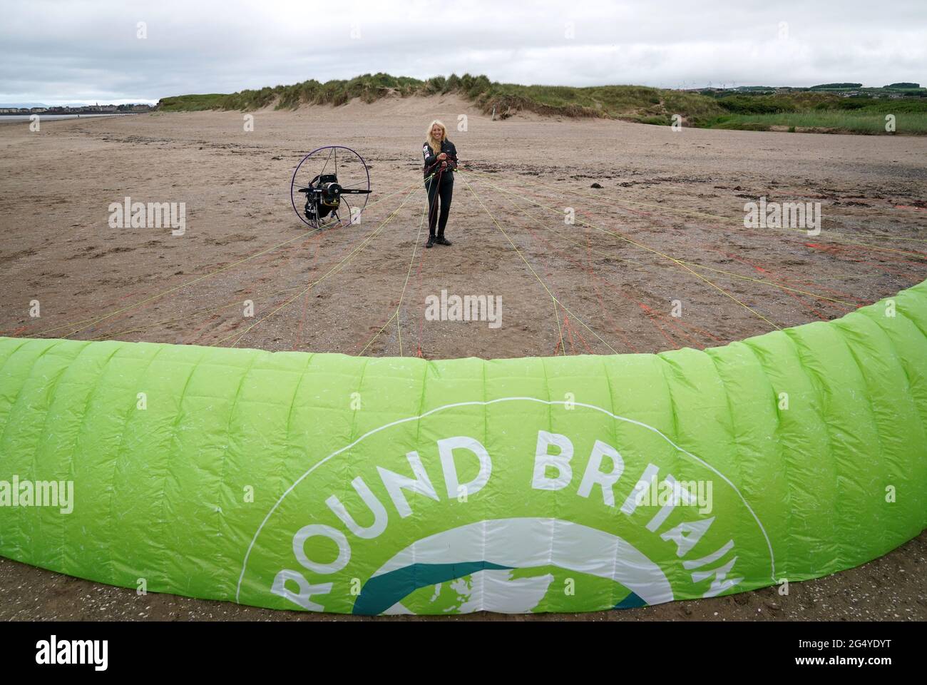 Paramotorist Sacha Dench with her adapted electric paramotor and glider ...