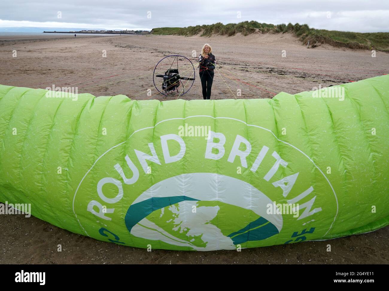 Paramotorist Sacha Dench with her adapted electric paramotor and glider ...