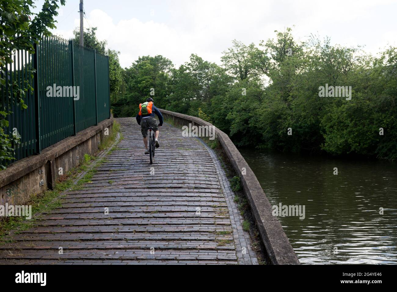 A cyclist alongside the Grand Union Canal at bridge 88c, Tyseley ...