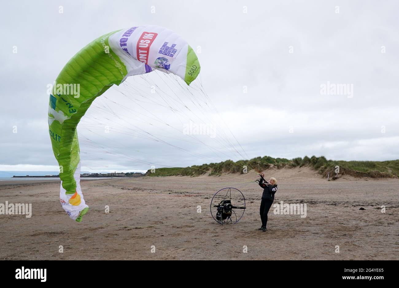 Paramotorist Sacha Dench with her adapted electric paramotor and glider ...
