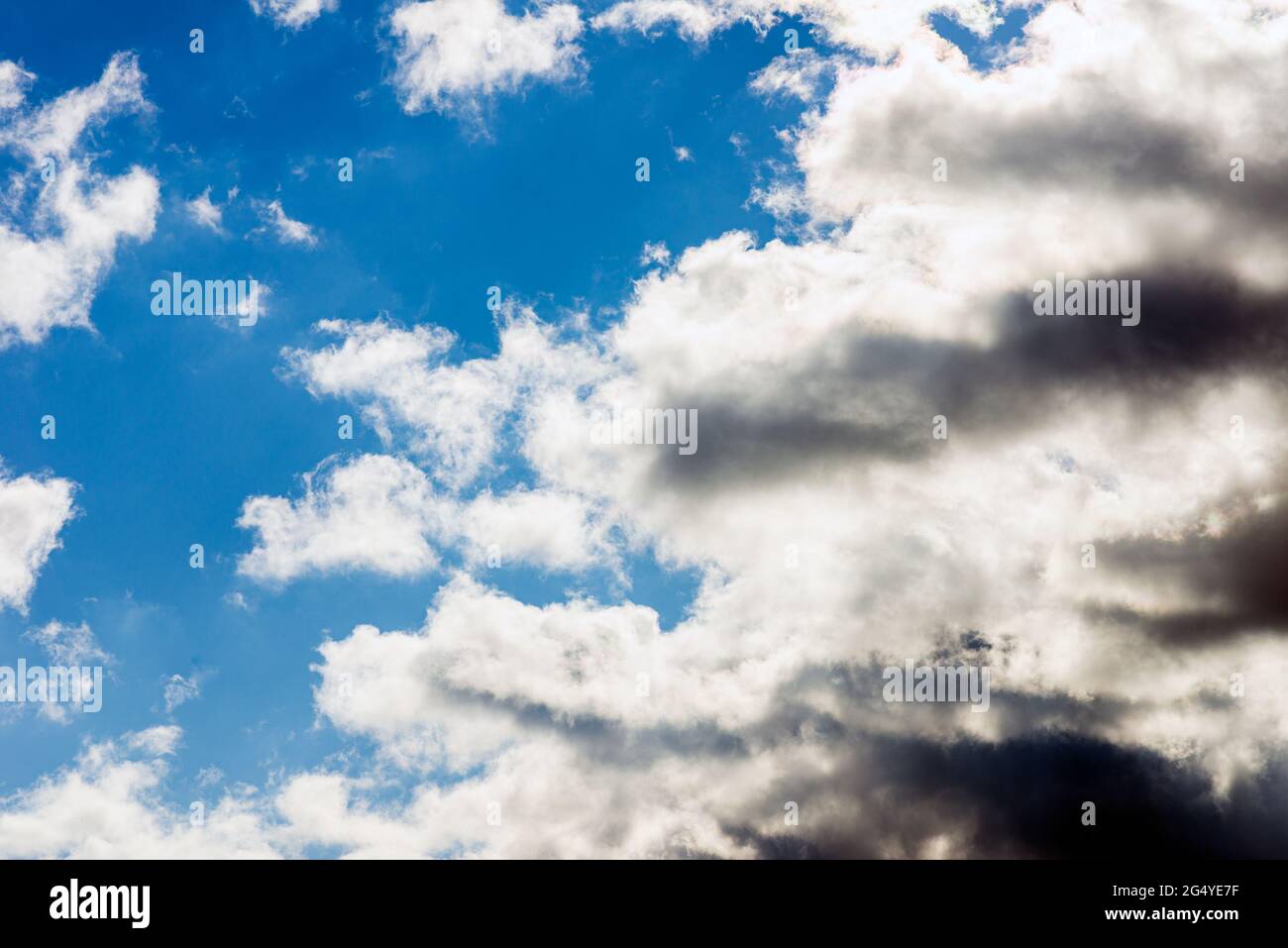 white fluffy clouds in the blue sky background.Blue cloudy white sky in ...
