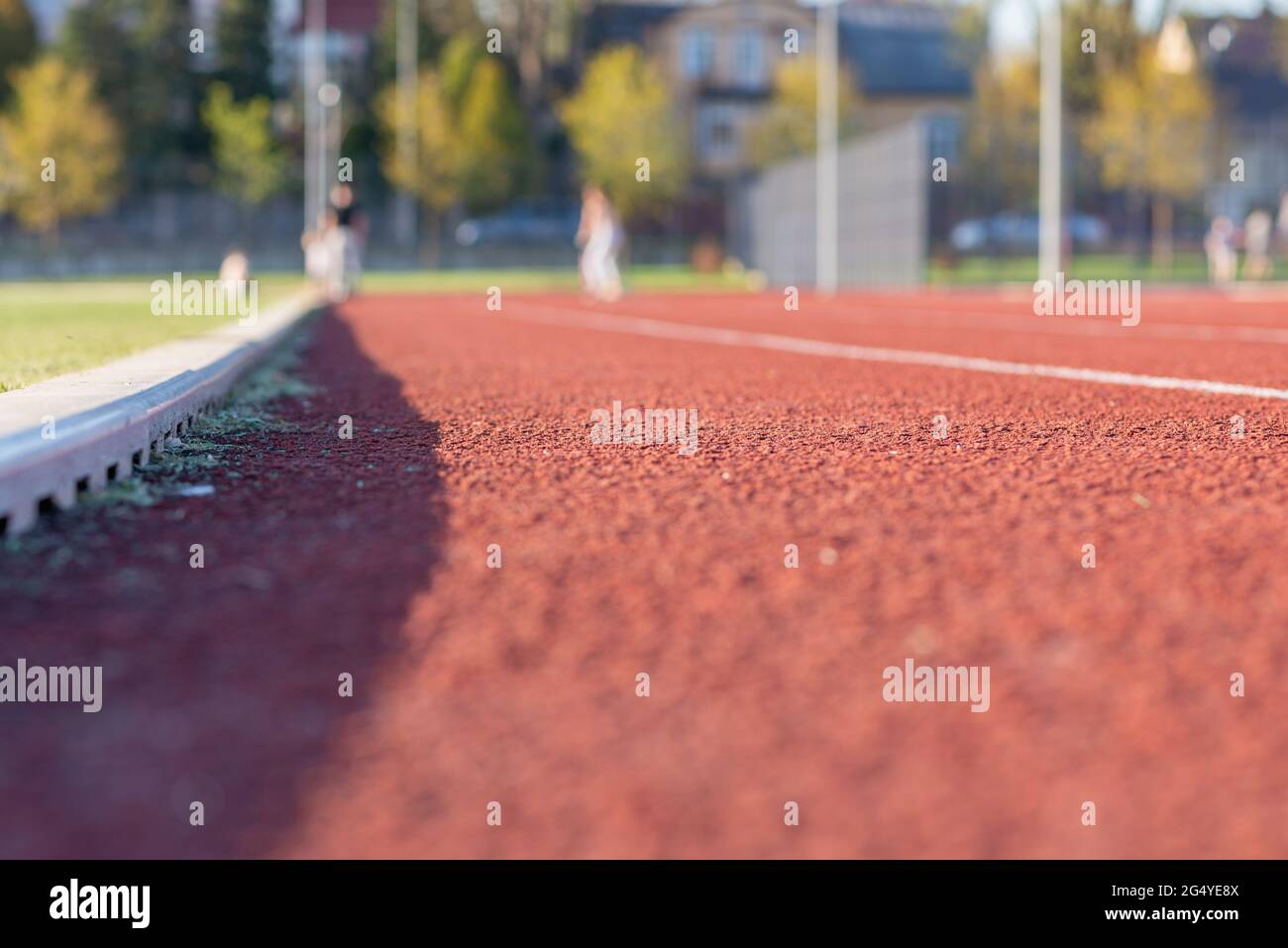 Red plastic track in the outdoor track and field stadium.Closeup Stock ...
