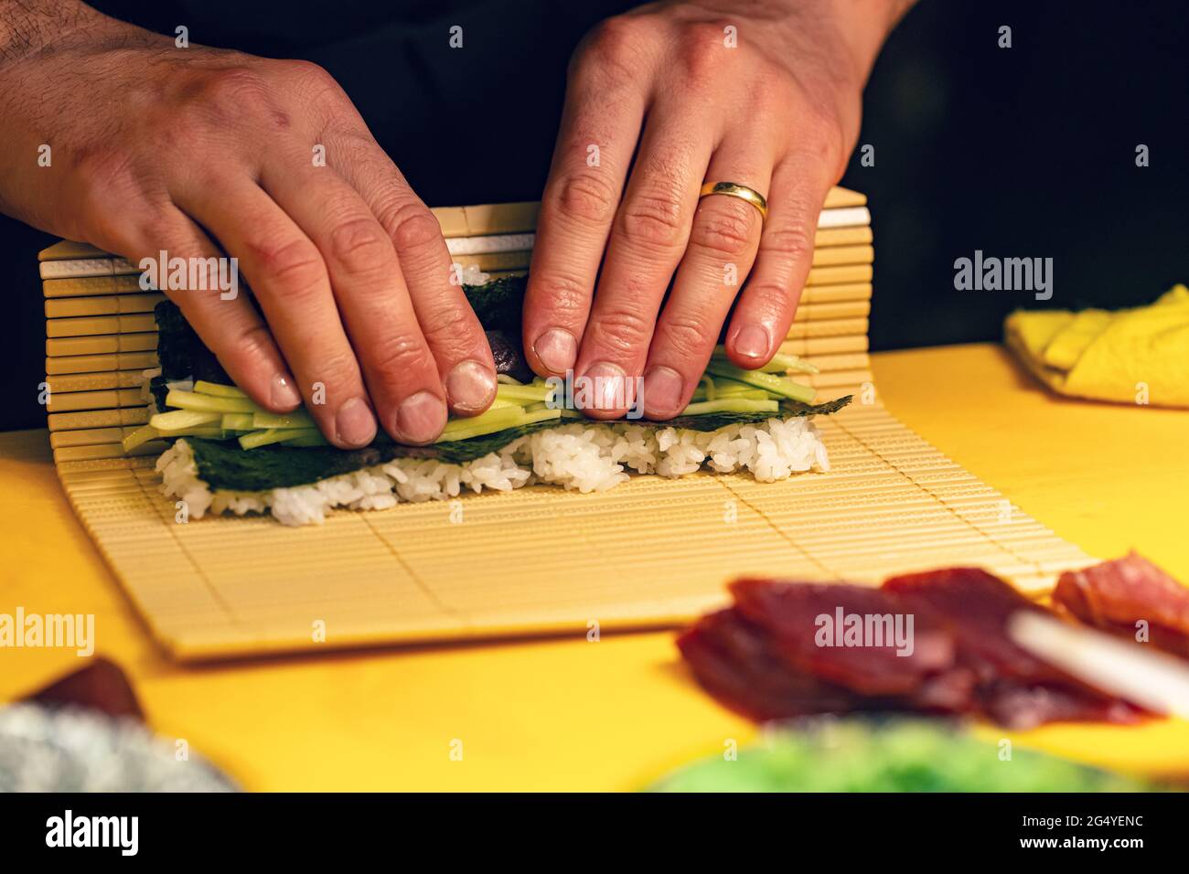 Chef hands preparing japanese food, chef making sushi, preparing sushi ...