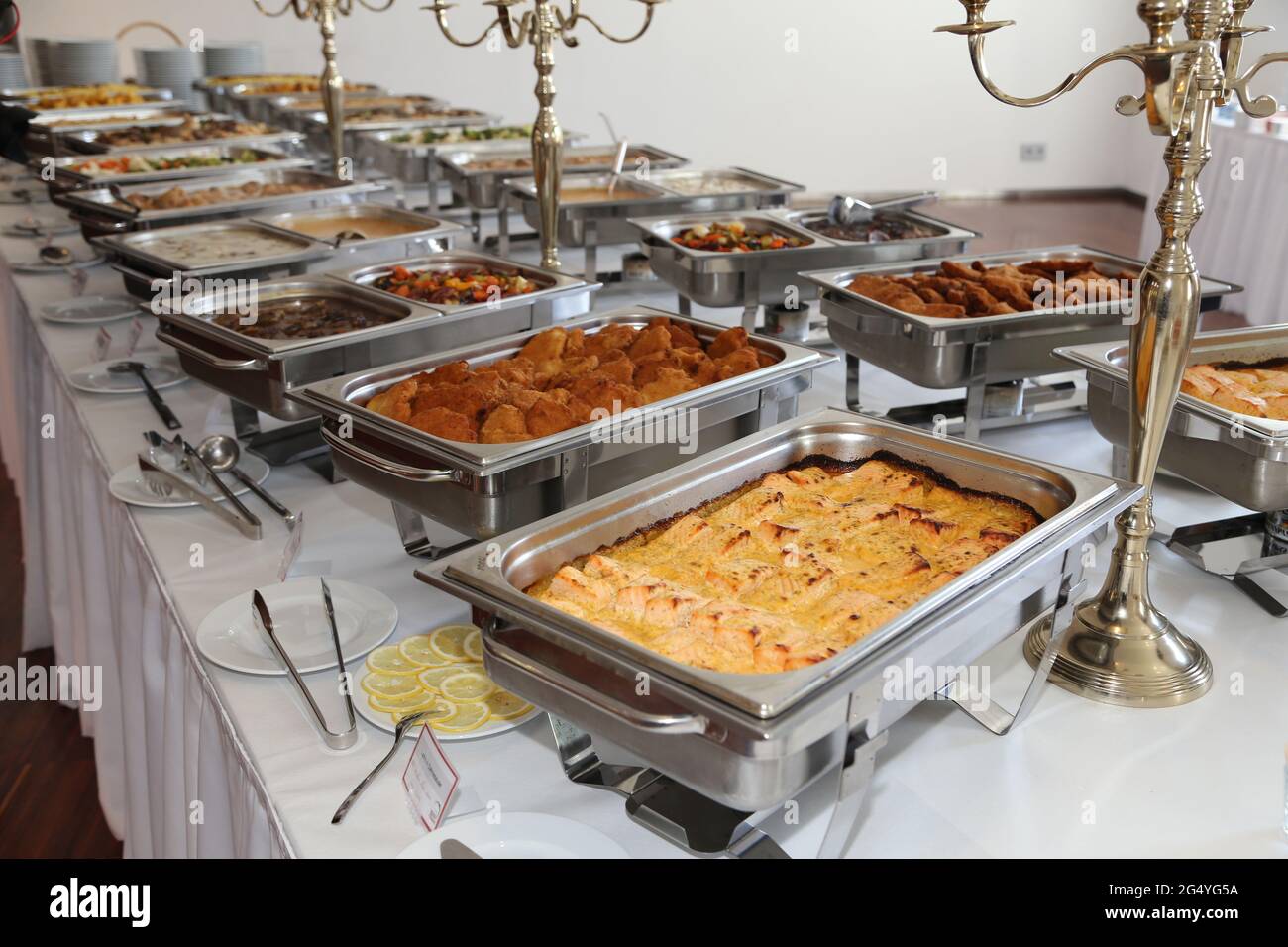Row of various delicious dishes at a buffet Stock Photo - Alamy