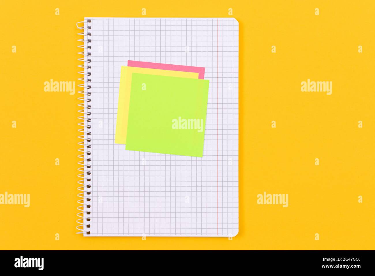 A Notepad with Sticky Notes Lying on Yellow Table - Blank Template. Top ...