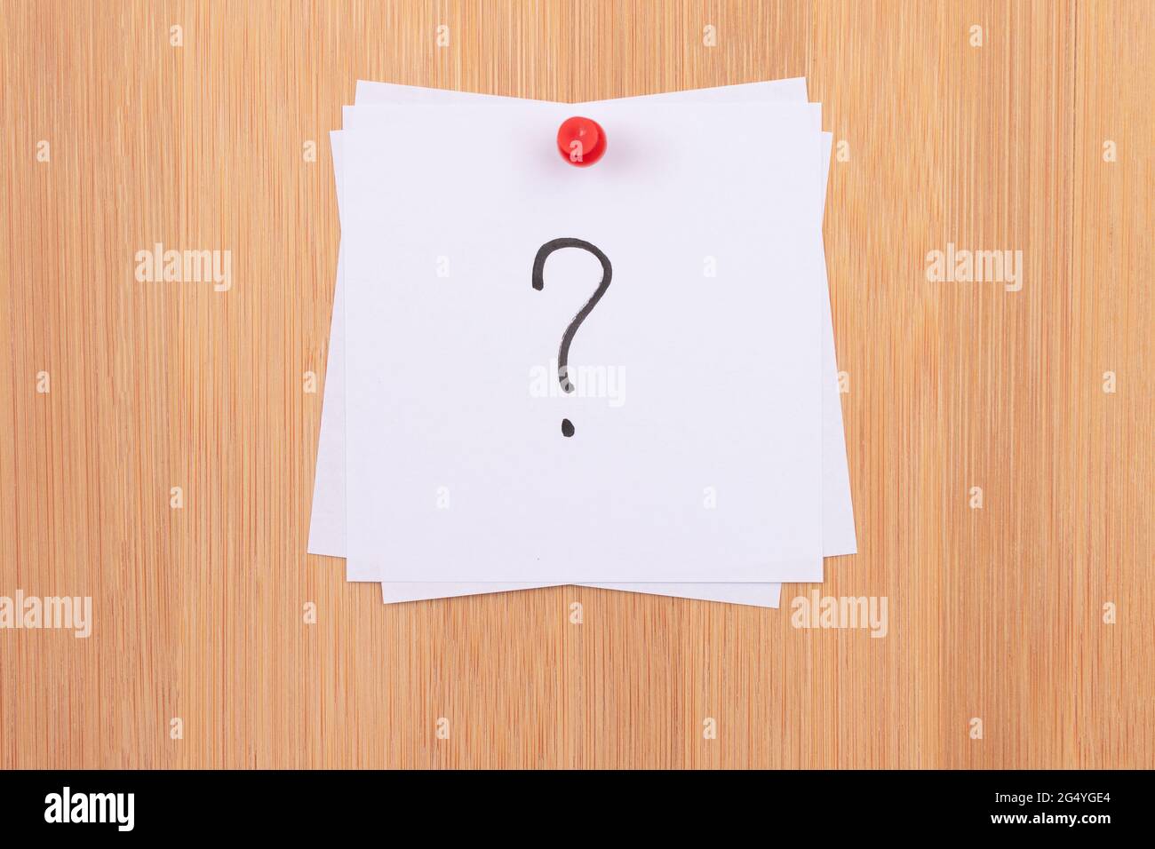 White Sticky Notes with Question Mark Pinned to the Wooden Message ...