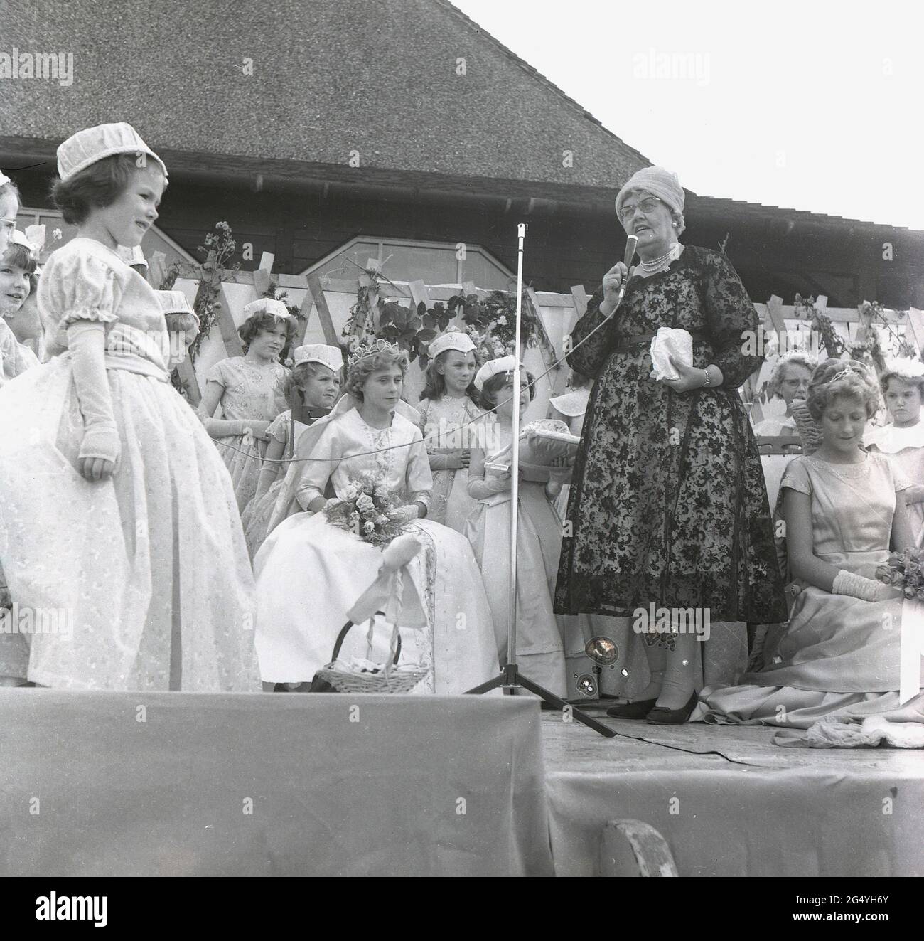 1950s, historical, in a public park, on a temporary stage, young girls ...