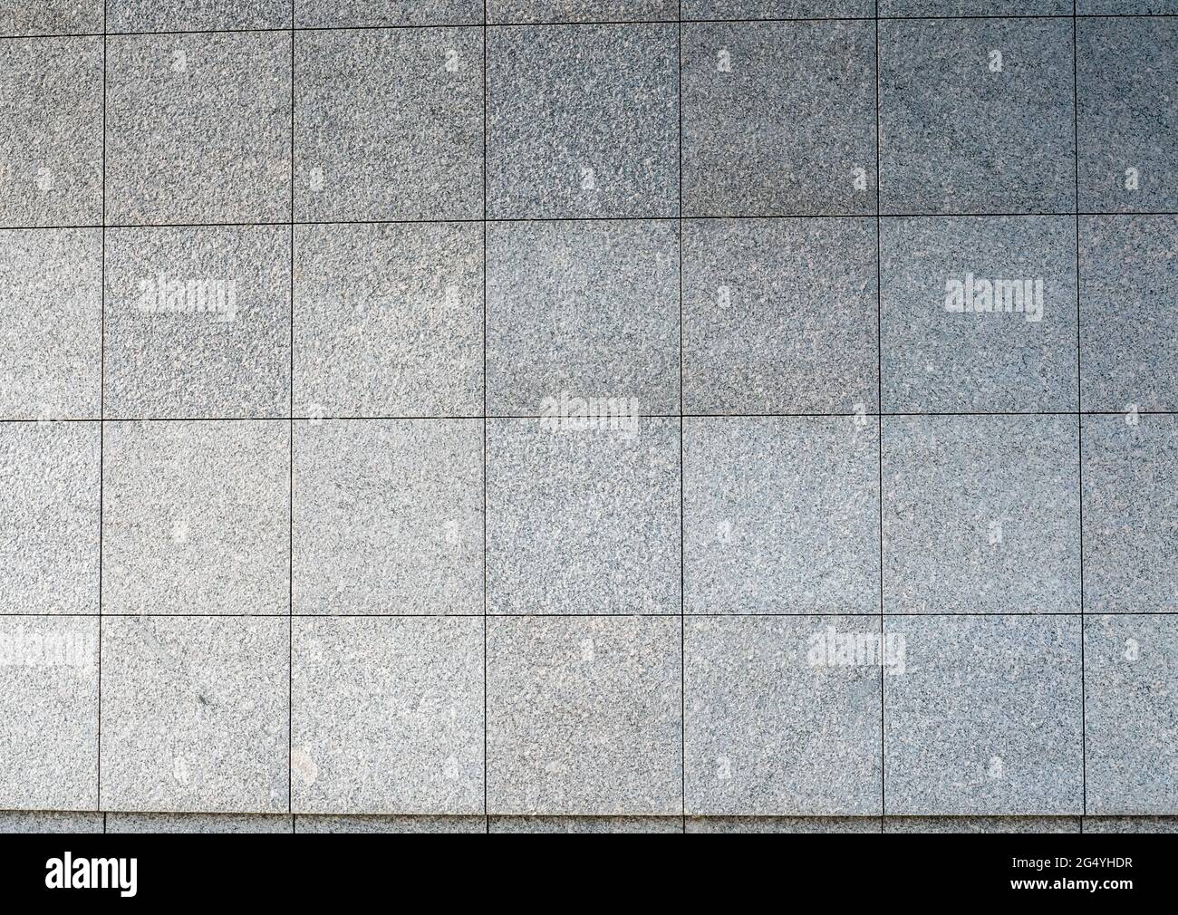 Gray stone brick wall tile for background Stock Photo - Alamy