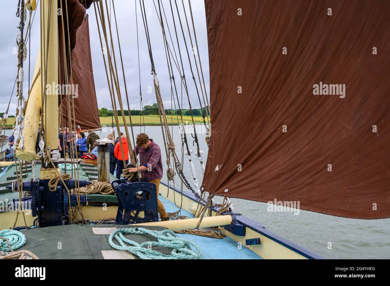 Crew and guests on "Edith May", a historic sailing barge, on a charter ...