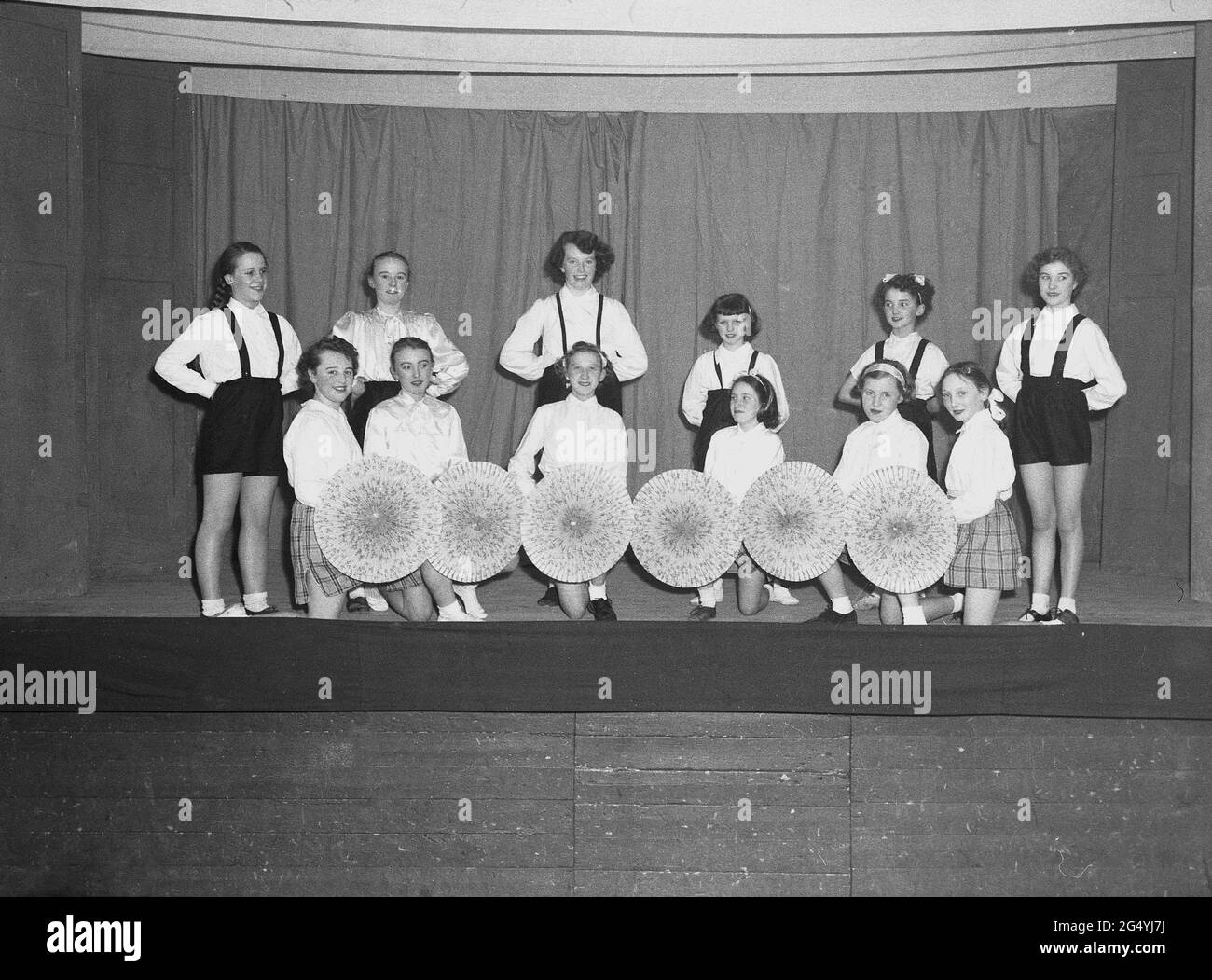 1954, historical, a group of young girl dancers on stage in their ...