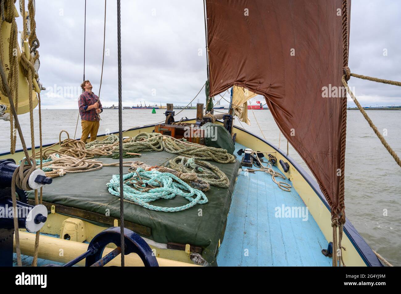 Skipper Ed Gransden rigging sails on "Edith May" historic sailing barge ...