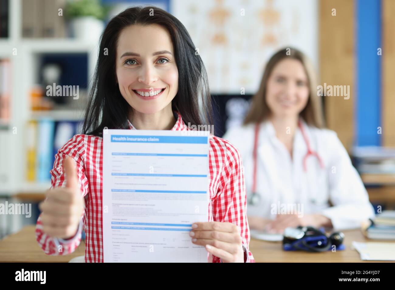 Insurance form for health in female patient in clinic Stock Photo - Alamy