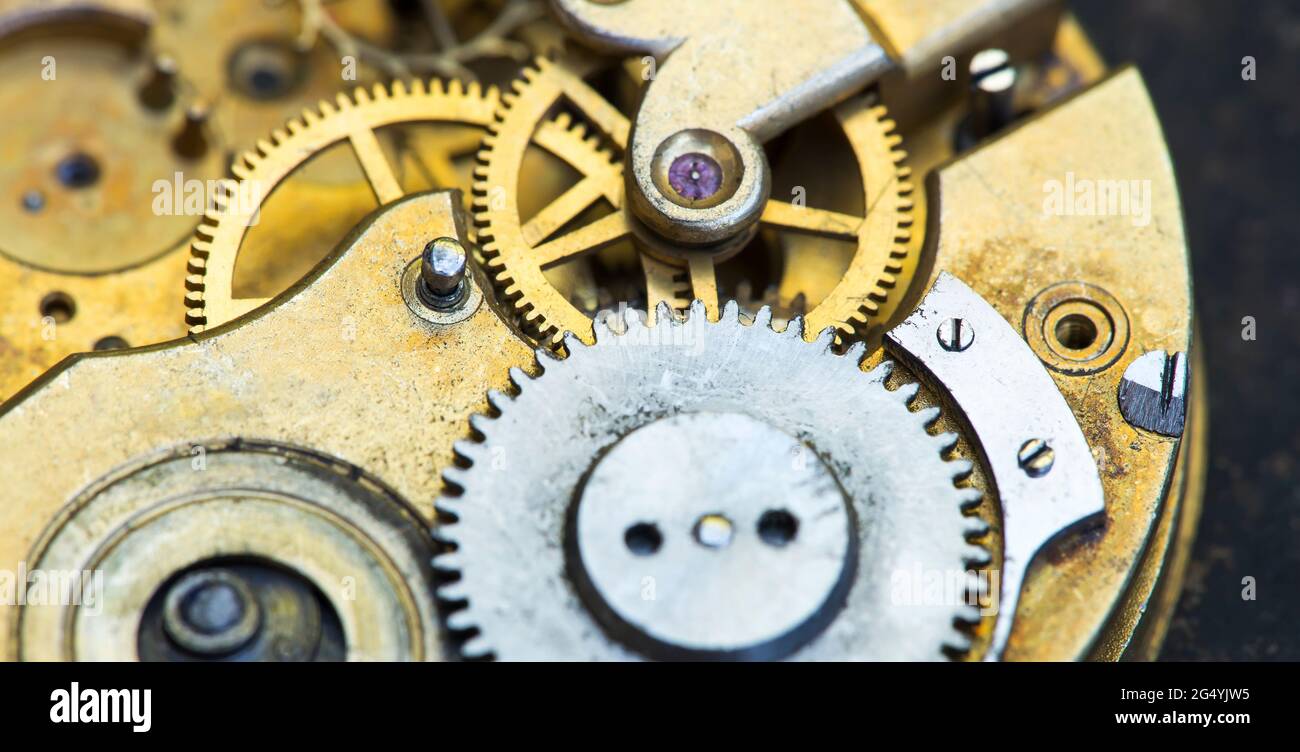 Gears of a vintage metal business clock watch clockwork, time mechanism ...