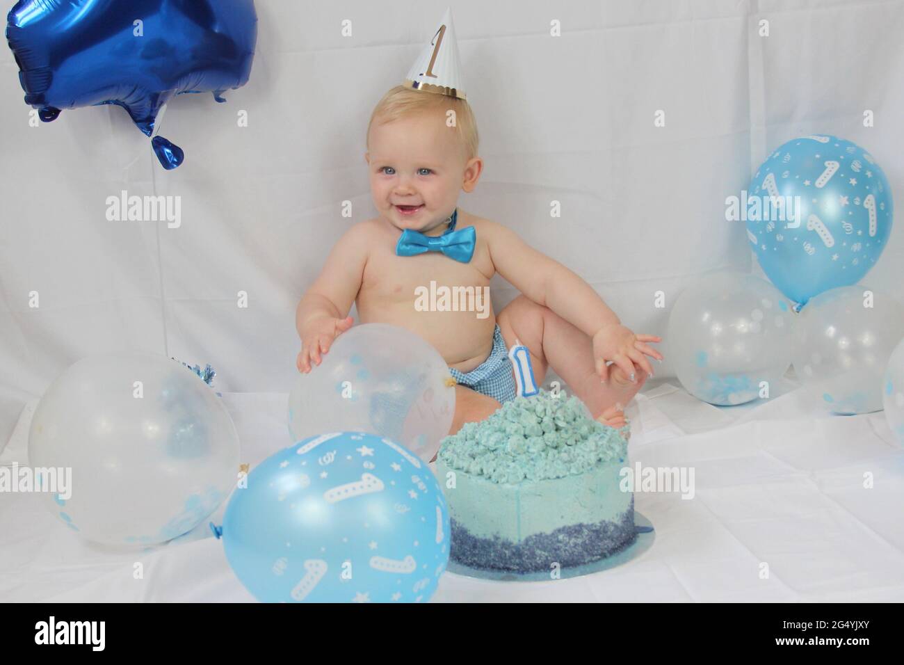 Baby boy first birthday, a cake smash party Stock Photo - Alamy