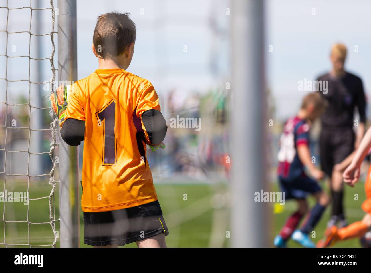 Young Boy Soccer Goalie Standing in a Goal in Orange Football Uniform ...