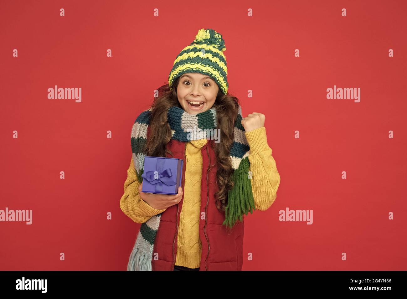 happy childhood. teen girl hold box. knitted clothing style. new year ...