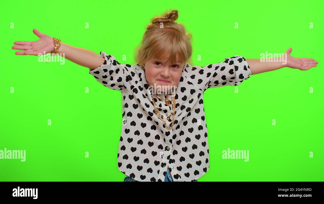 Puzzled clueless uncertain blonde kid child raising hands in helpless ...