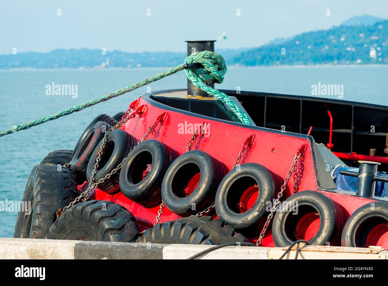 The side of the boat is hung with old tires to protect against impact ...