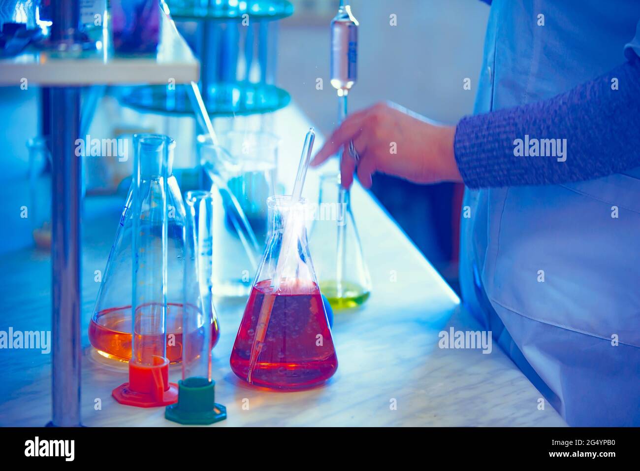 Vaccine production laboratory. Glass flasks with a chemical liquid in ...