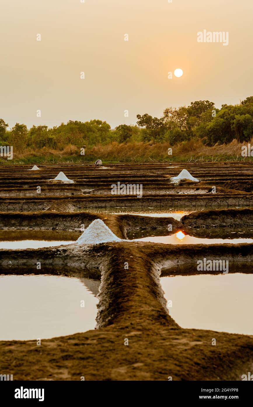 Beautiful shot of salt evaporation ponds on background of the orange ...