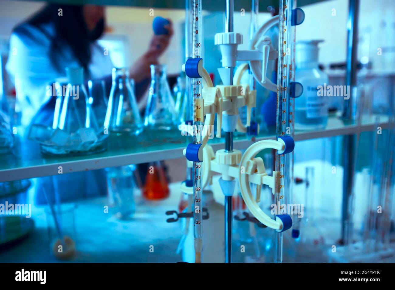 Vaccine production laboratory. Glass flasks with a chemical liquid in ...