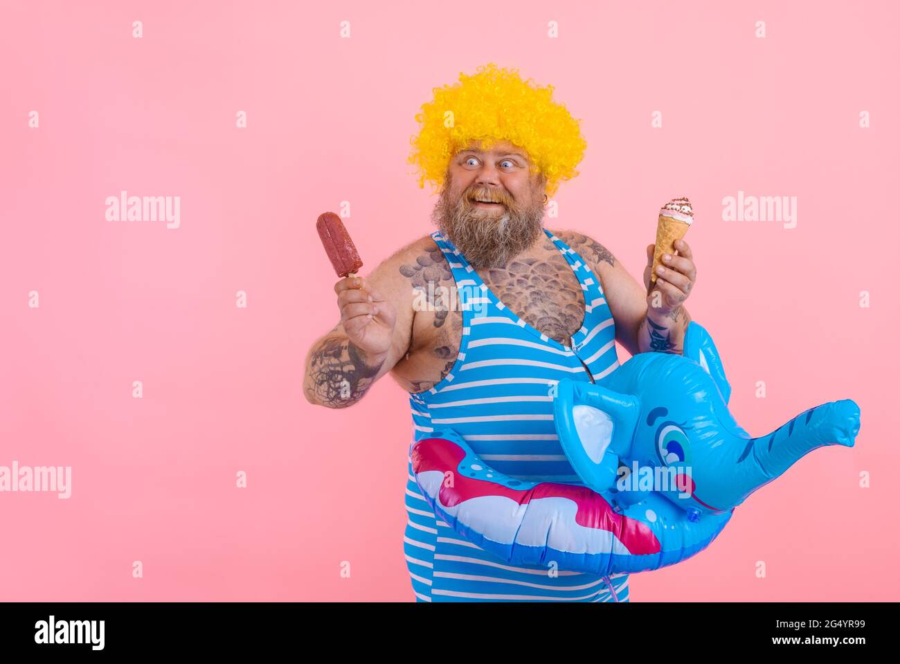 Fat man with beard and wig eats a popsicle and an icecream Stock Photo ...