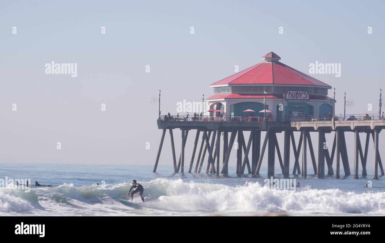 Huntington Beach, California USA - 2 Dec 2020: People surfing in ocean ...