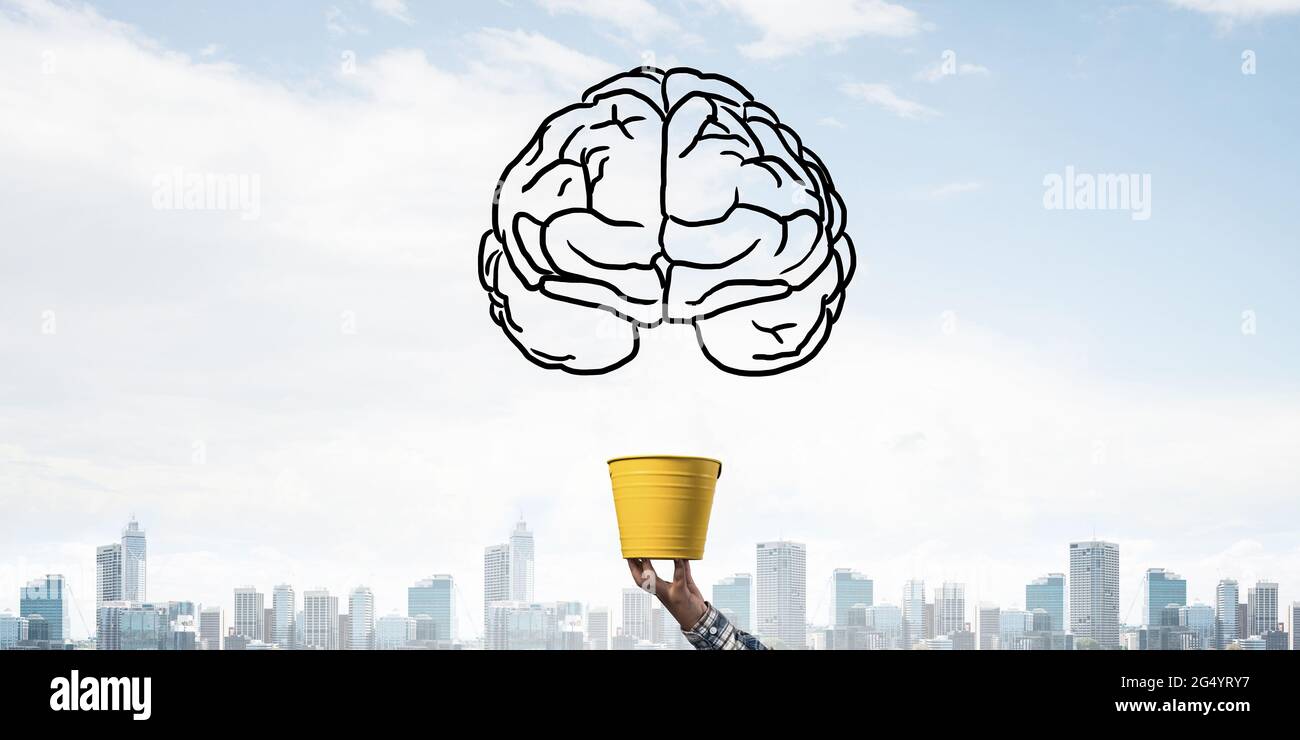 Brain drawing flying above yellow pot Stock Photo - Alamy