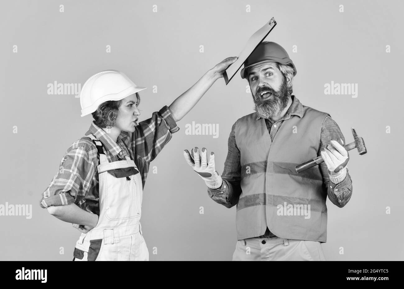you are bad worker. woman and man wear safety hardhat. family standing ...