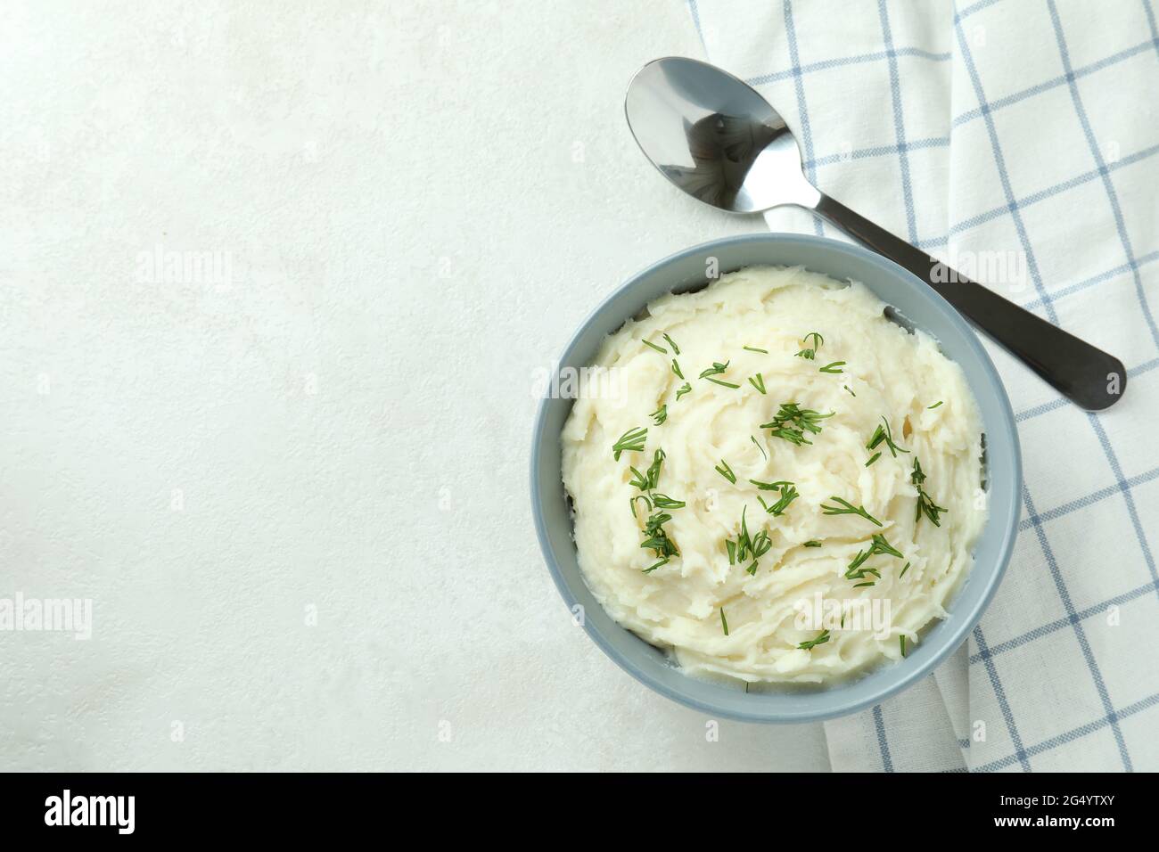 Bowl of mashed potatoes on white textured background Stock Photo - Alamy