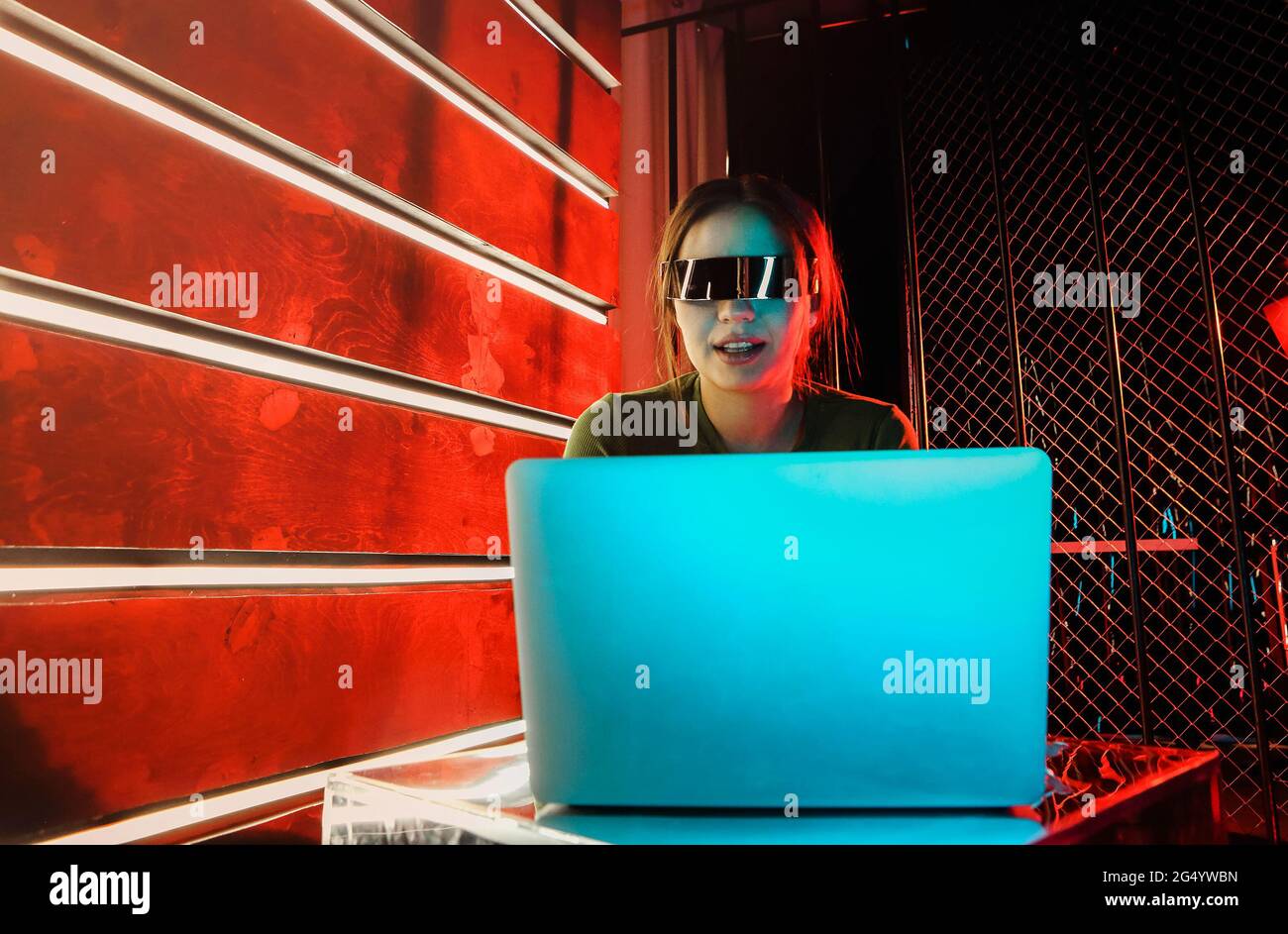 Portrait female in glasses browsing and watching video on netbook Stock ...