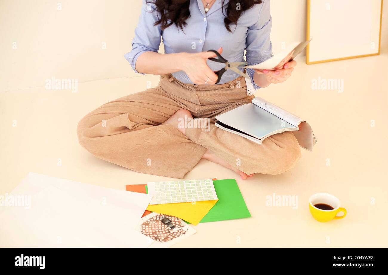 Young brunette woman creating her Feng Shui wish map. Dreams and wishes ...