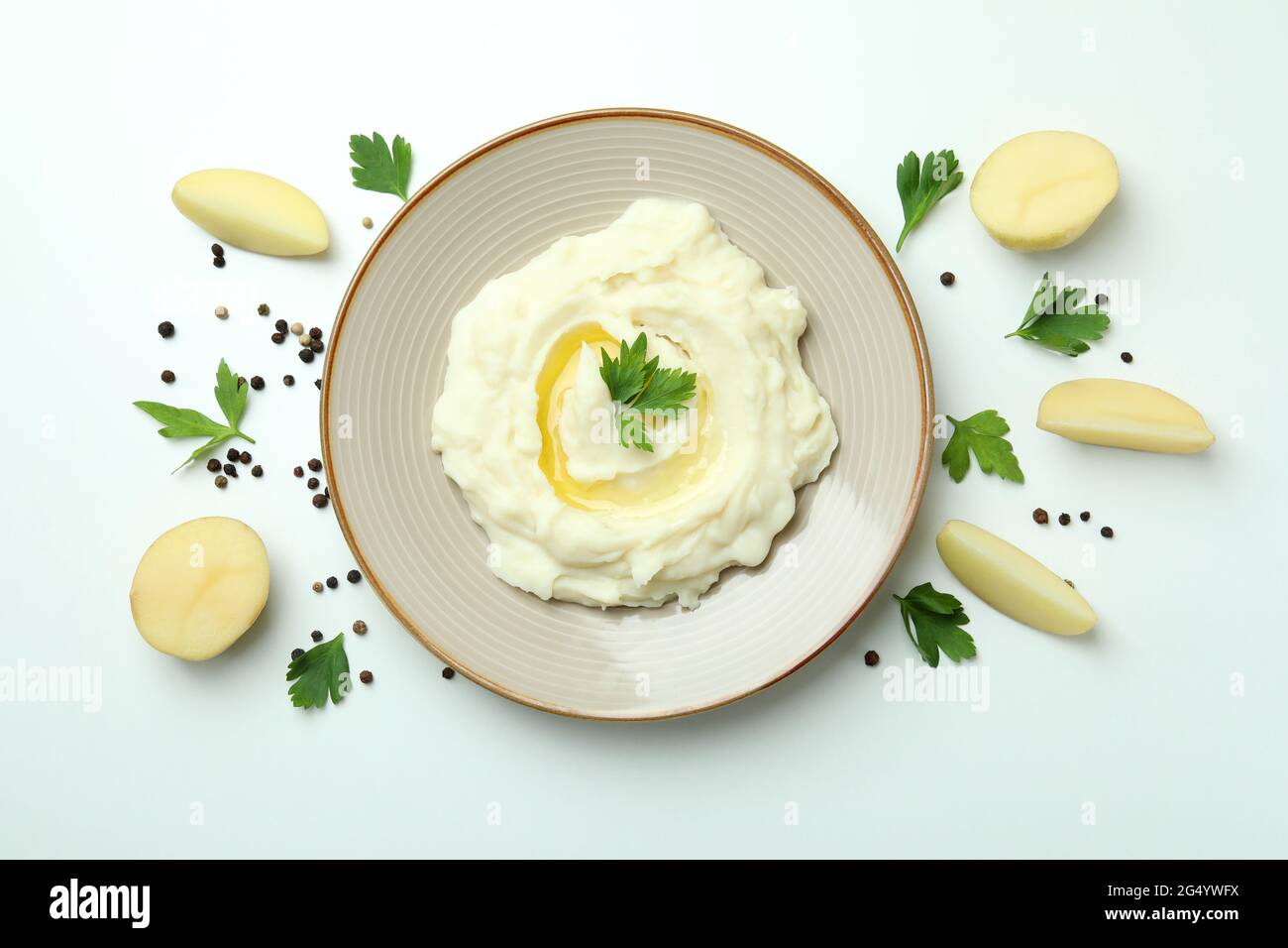 Plate of mashed potatoes and ingredients on white background Stock ...