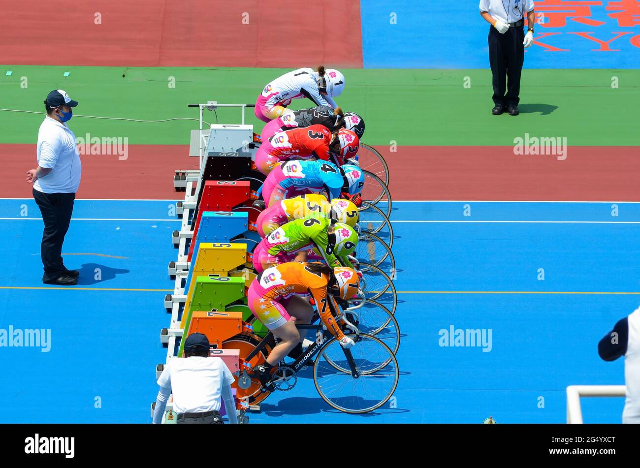 Female competitors in a "keirin" cycle race at Kyoto Keirin Racetrack ...