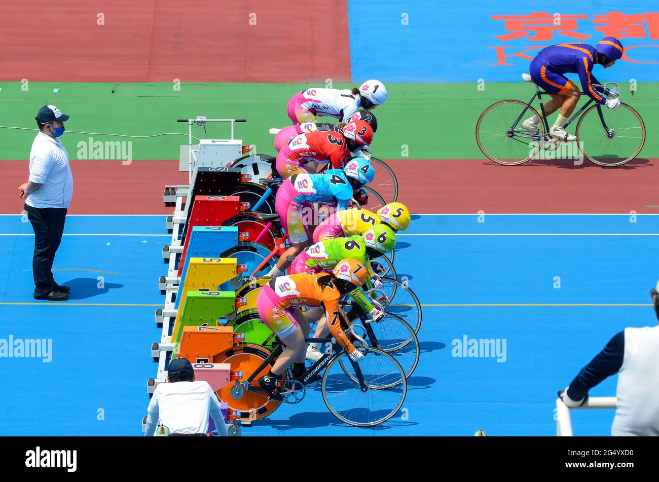 Female competitors in a "keirin" cycle race at Kyoto Keirin Racetrack ...