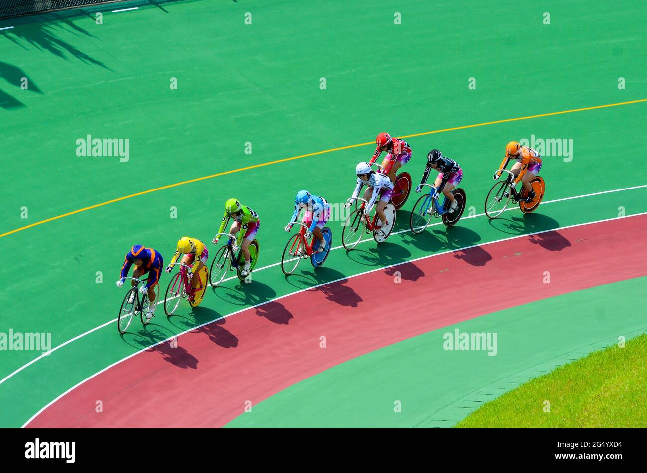 Female competitors in a "keirin" cycle race at Kyoto Keirin Racetrack ...