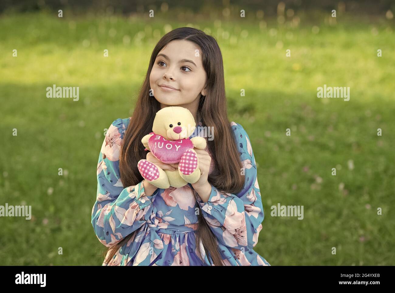 Girl kid hug soft toy teddy bear love symbol, kindness and charity ...