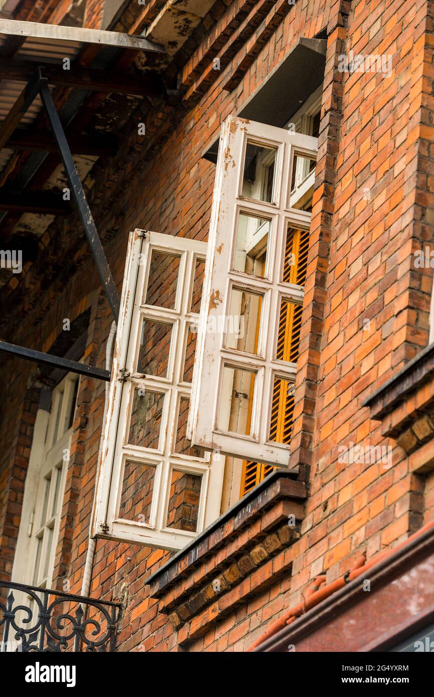 Open window in brick building architecture concept Stock Photo - Alamy