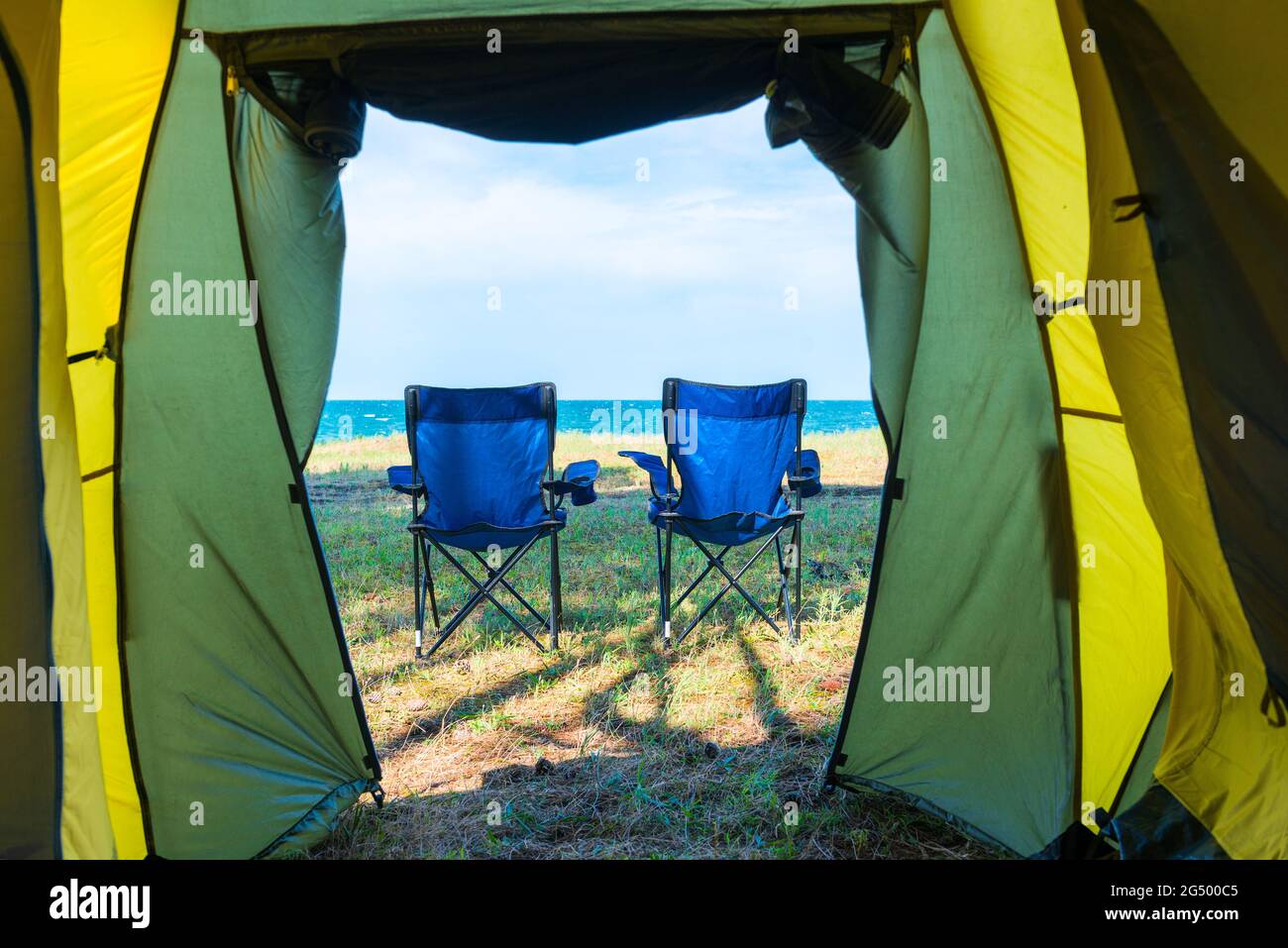 sea view and chairs from the camping tent - concept vacation, camping ...