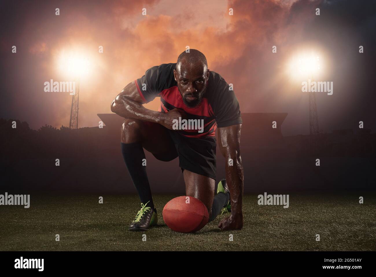 Professional male rugby player posing isolated on stadium background ...