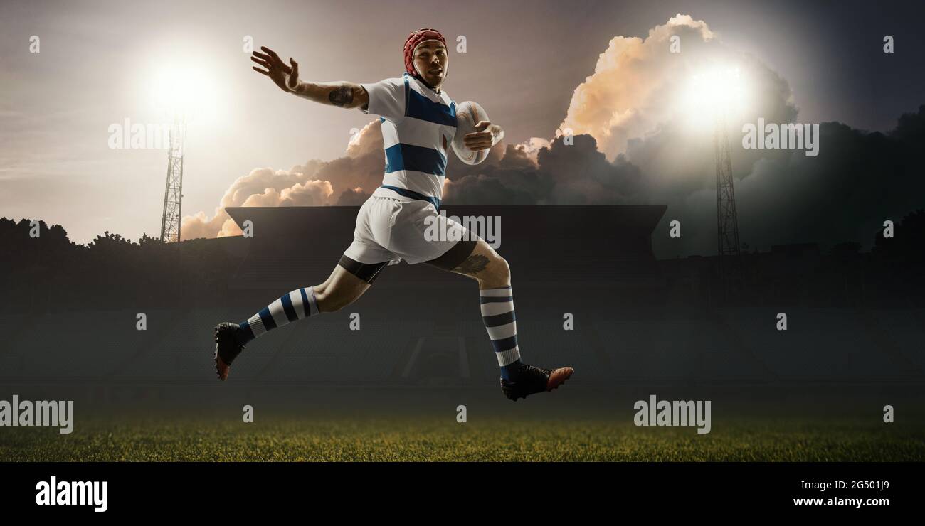 One caucasian man playing rugby on the stadium at stadium with ...