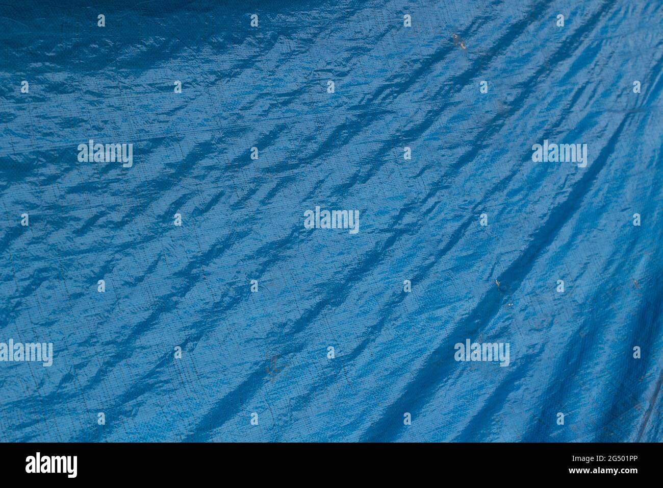Texture of a blue cloth bag. Blue plastic bag. Fine weave texture ...