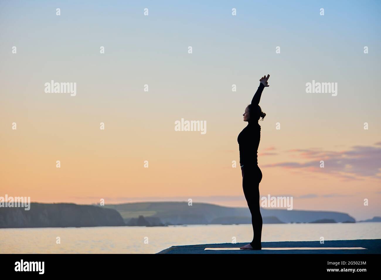 Upward Salute pose of woman Stock Photo - Alamy