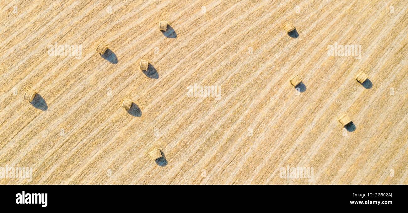 Aerial panorama of agricultural field with hay bales, natural pattern ...