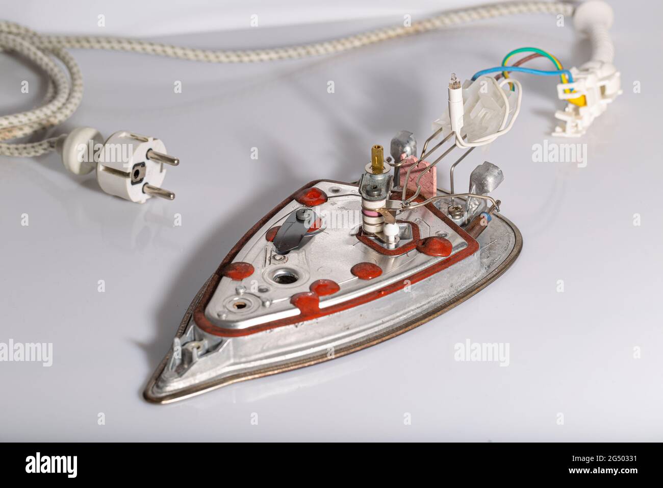 Components of a disassembled iron Stock Photo - Alamy