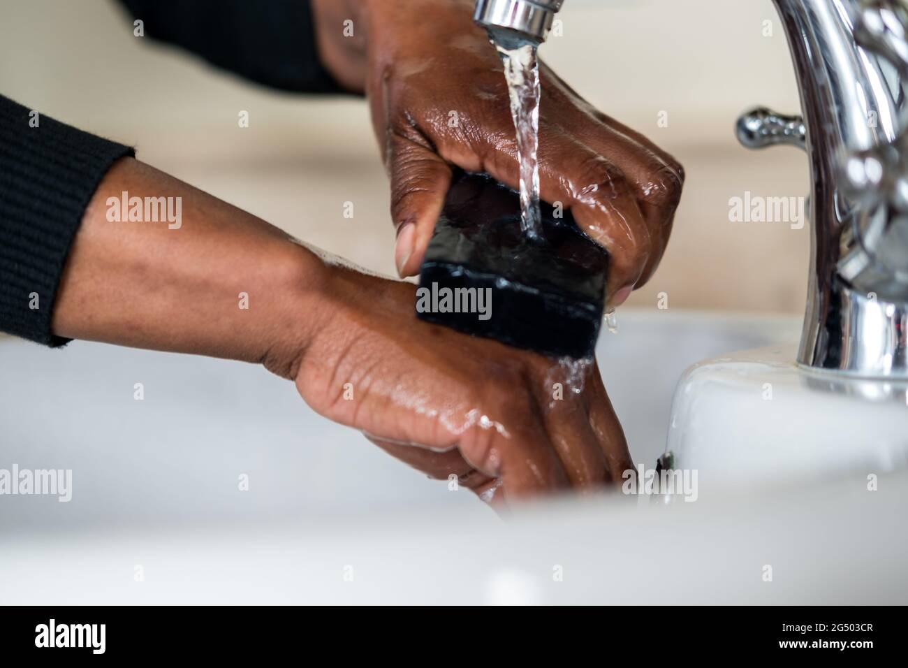 Soapy hands african hi-res stock photography and images - Alamy