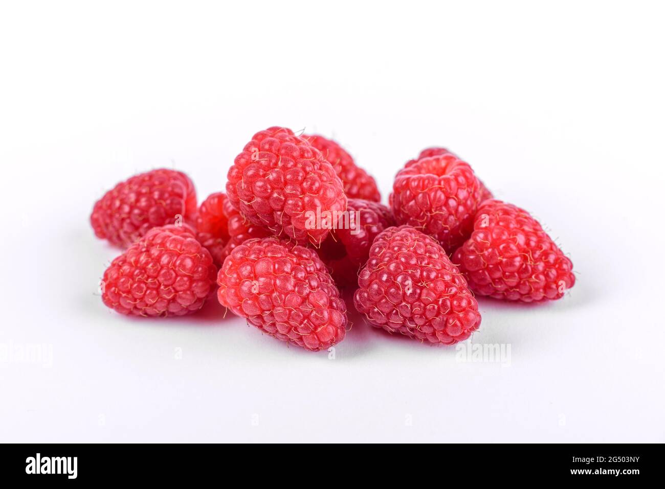 Ripe red raspberries isolated on white background Stock Photo - Alamy