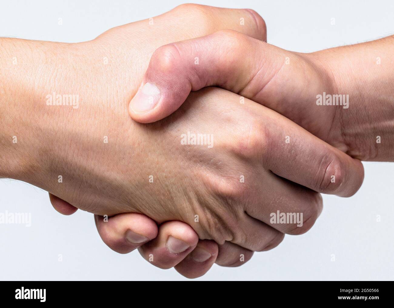 Handshake, arms friendship. Friendly handshake, friends greeting, teamwork, friendship. Close-up ...