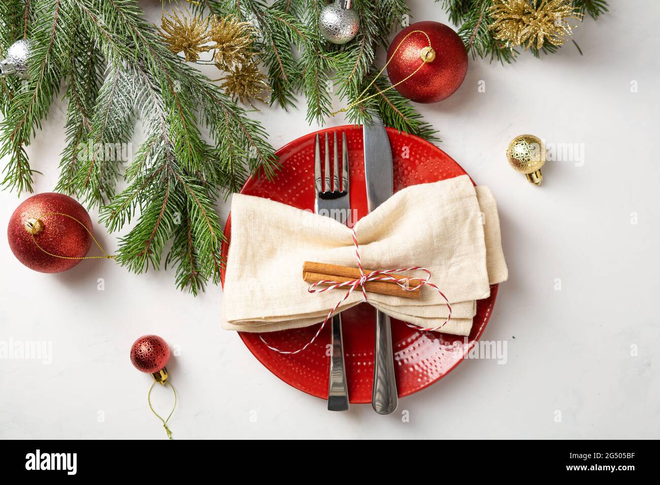 Christmas table dinner setting with red plate and decorations Stock ...