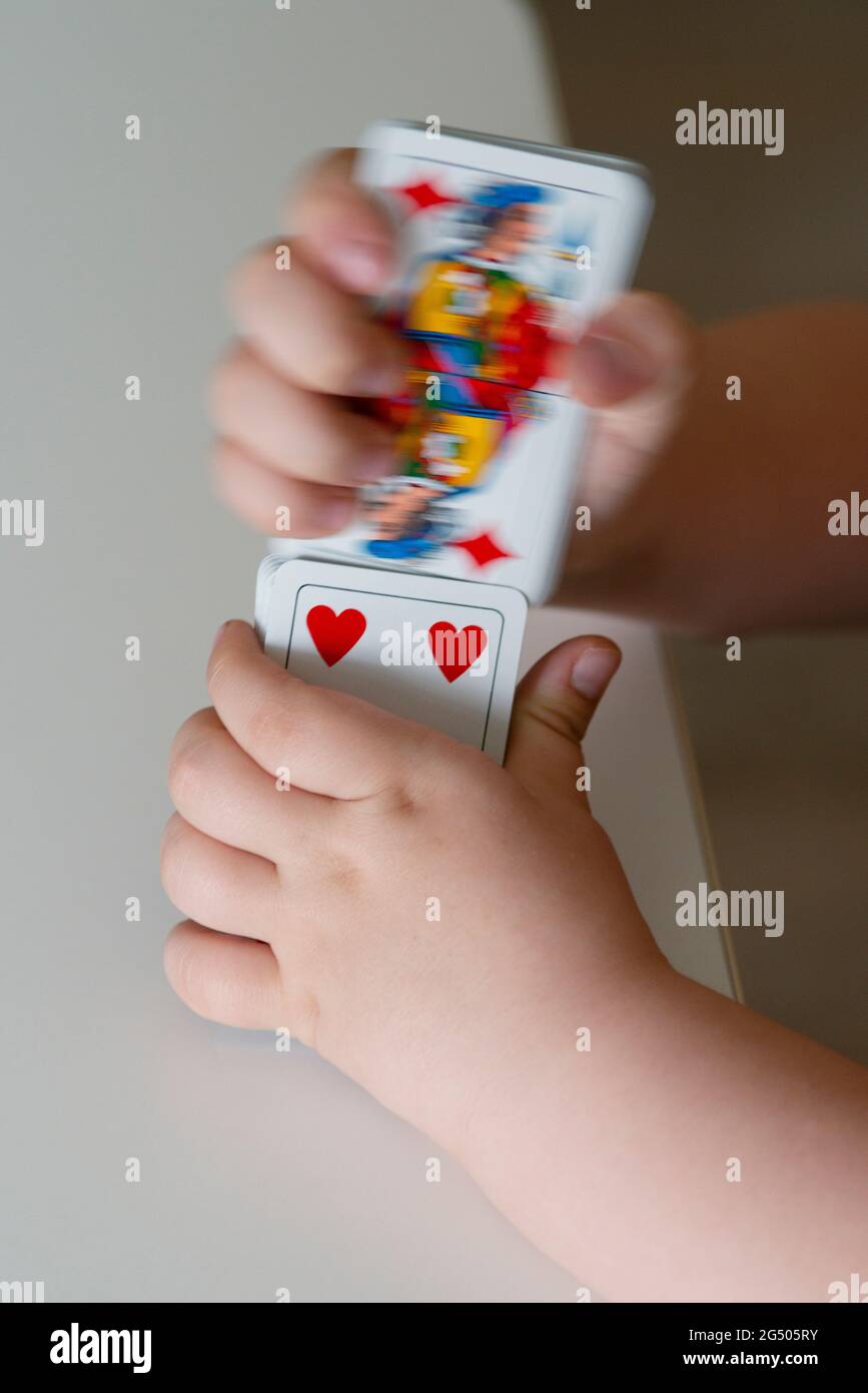 Children playing cards hi-res stock photography and images - Alamy